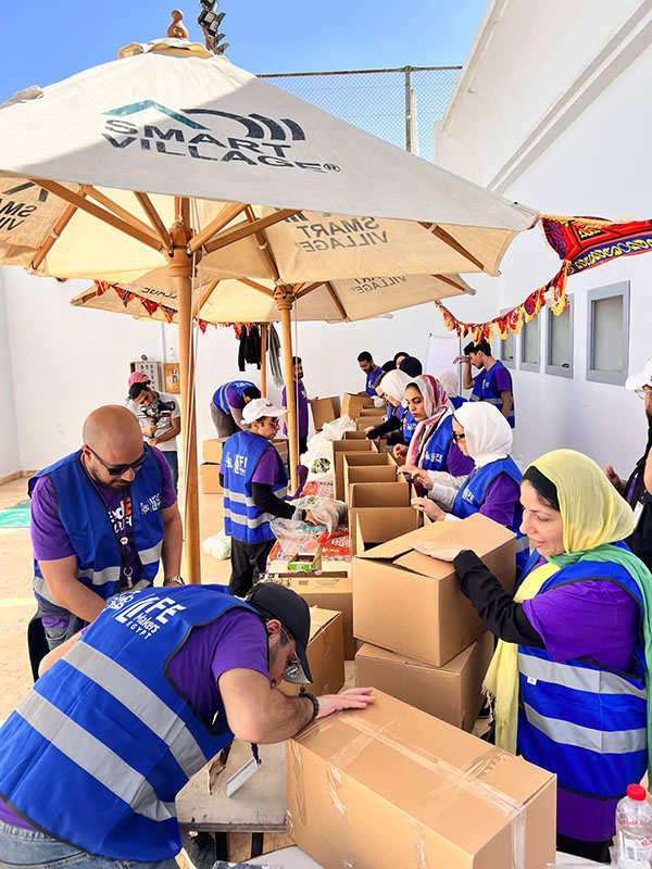 FedEx volunteers spread happiness with food package distribution during ...